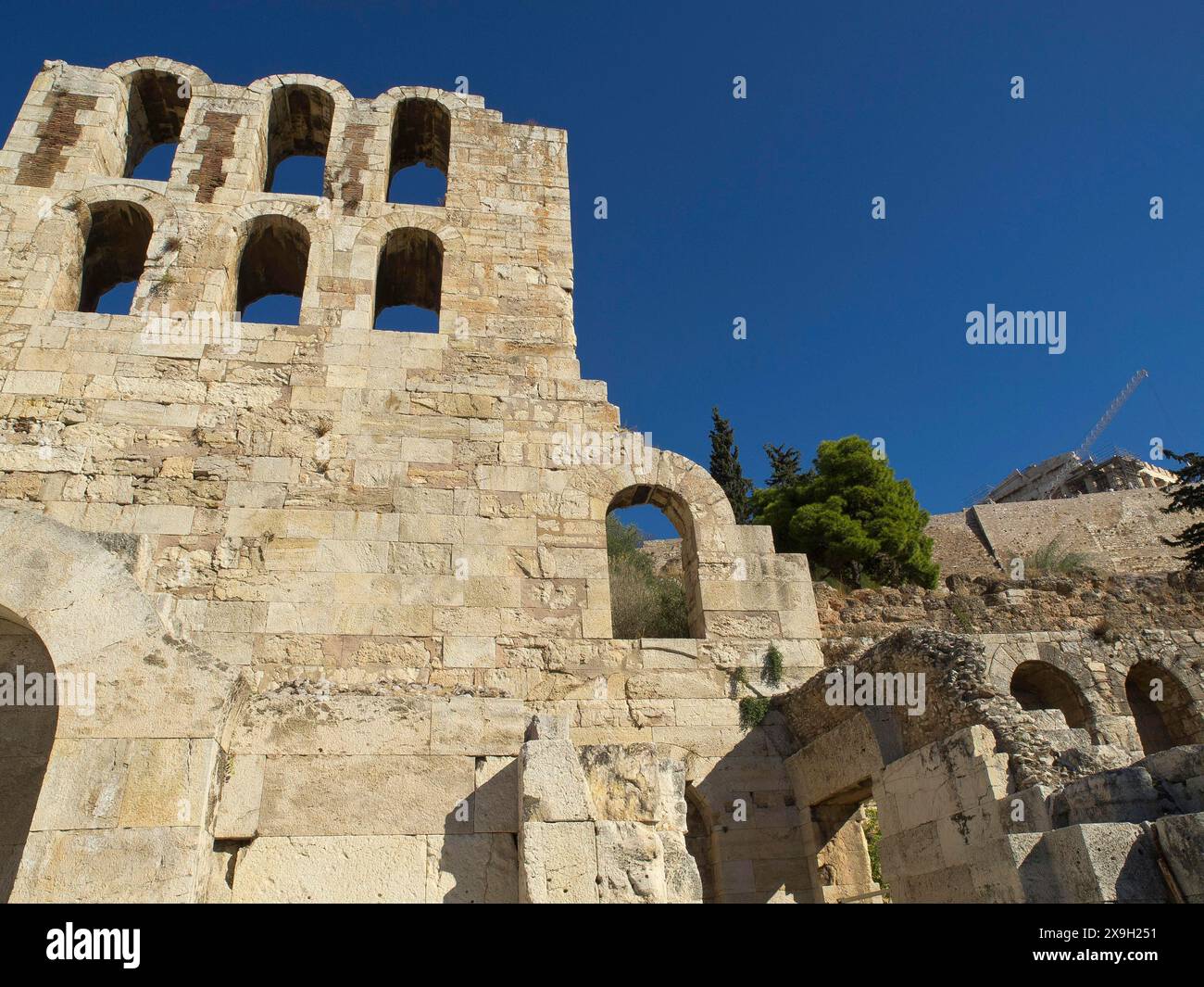 Ancient stone buildings with arches under a clear blue sky, Ancient ...