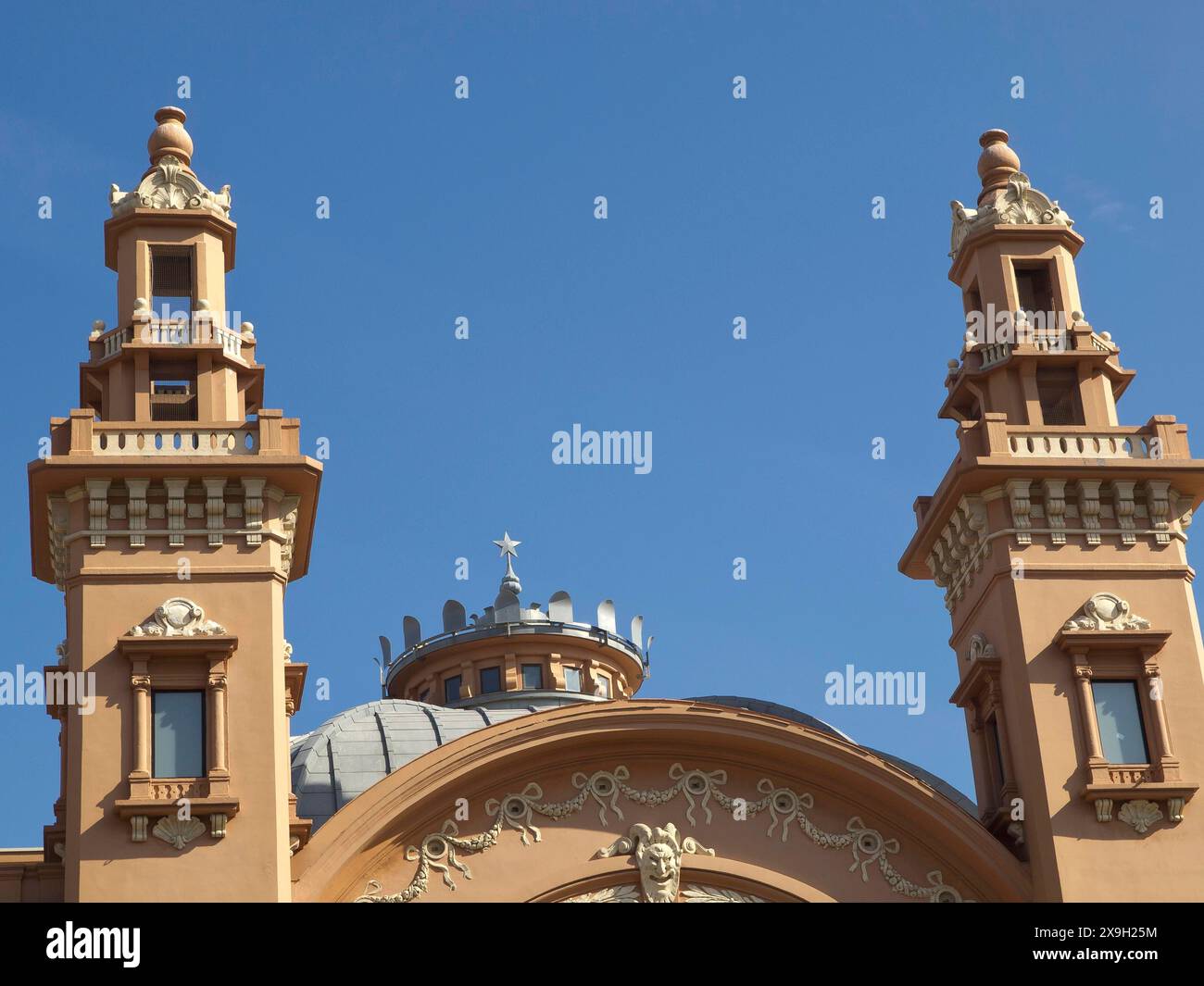Ornate towers of a historic building against a clear blue sky, The city ...