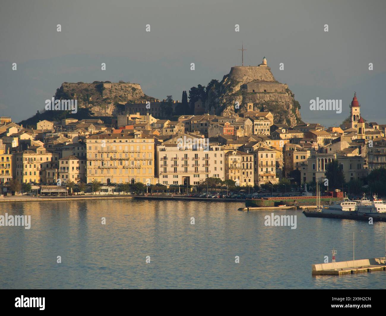 Historic town with a large fortress on a hill, surrounded by numerous ...