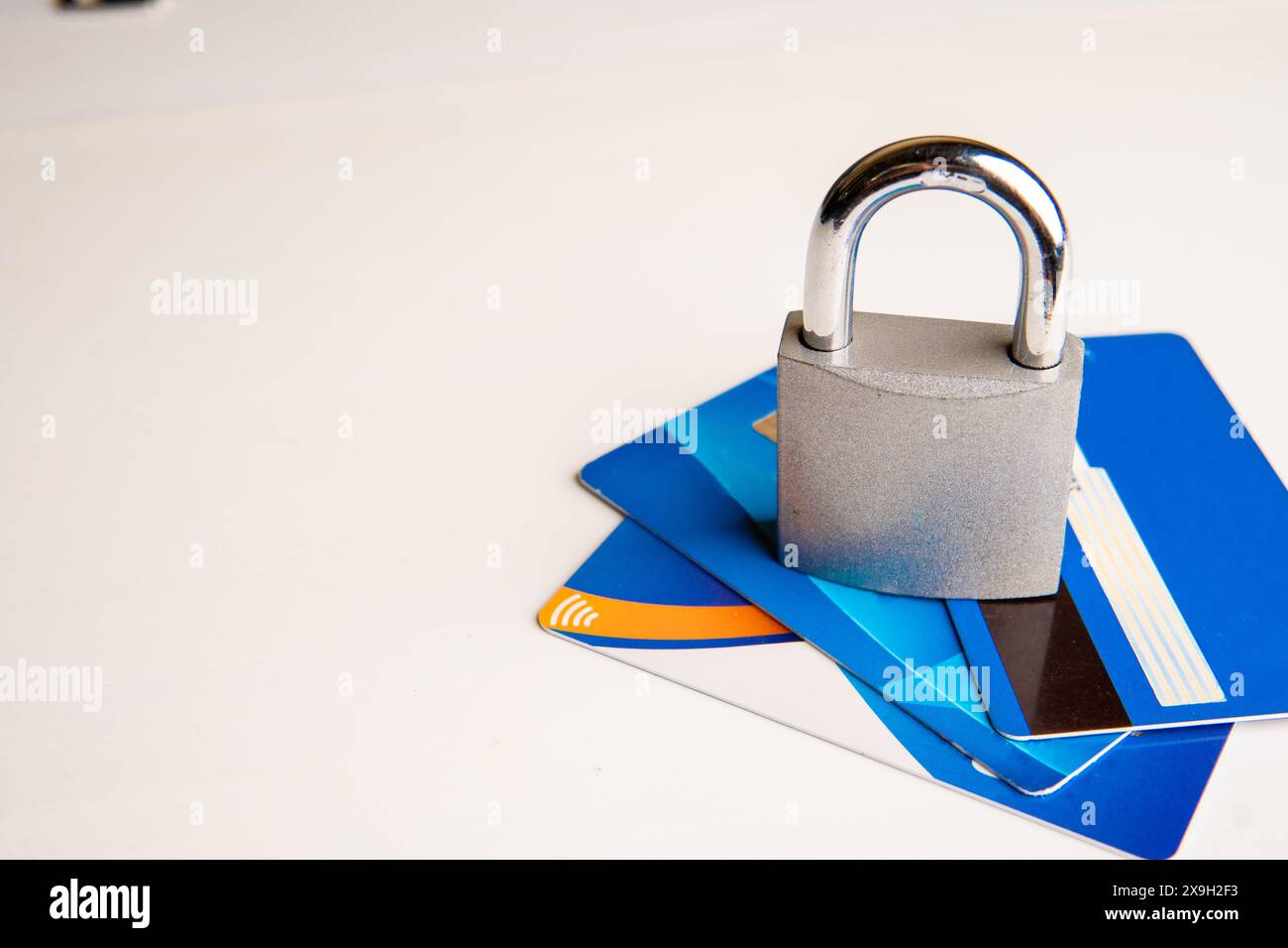 Concept of expense control, a closed padlock with credit cards on a ...