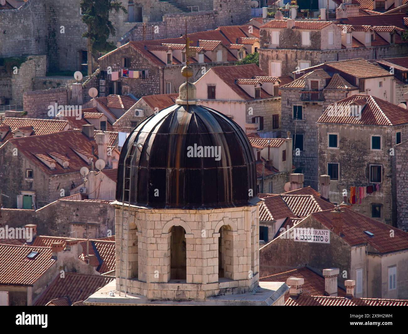 Domed roof of a church and surrounding old buildings with red roof ...