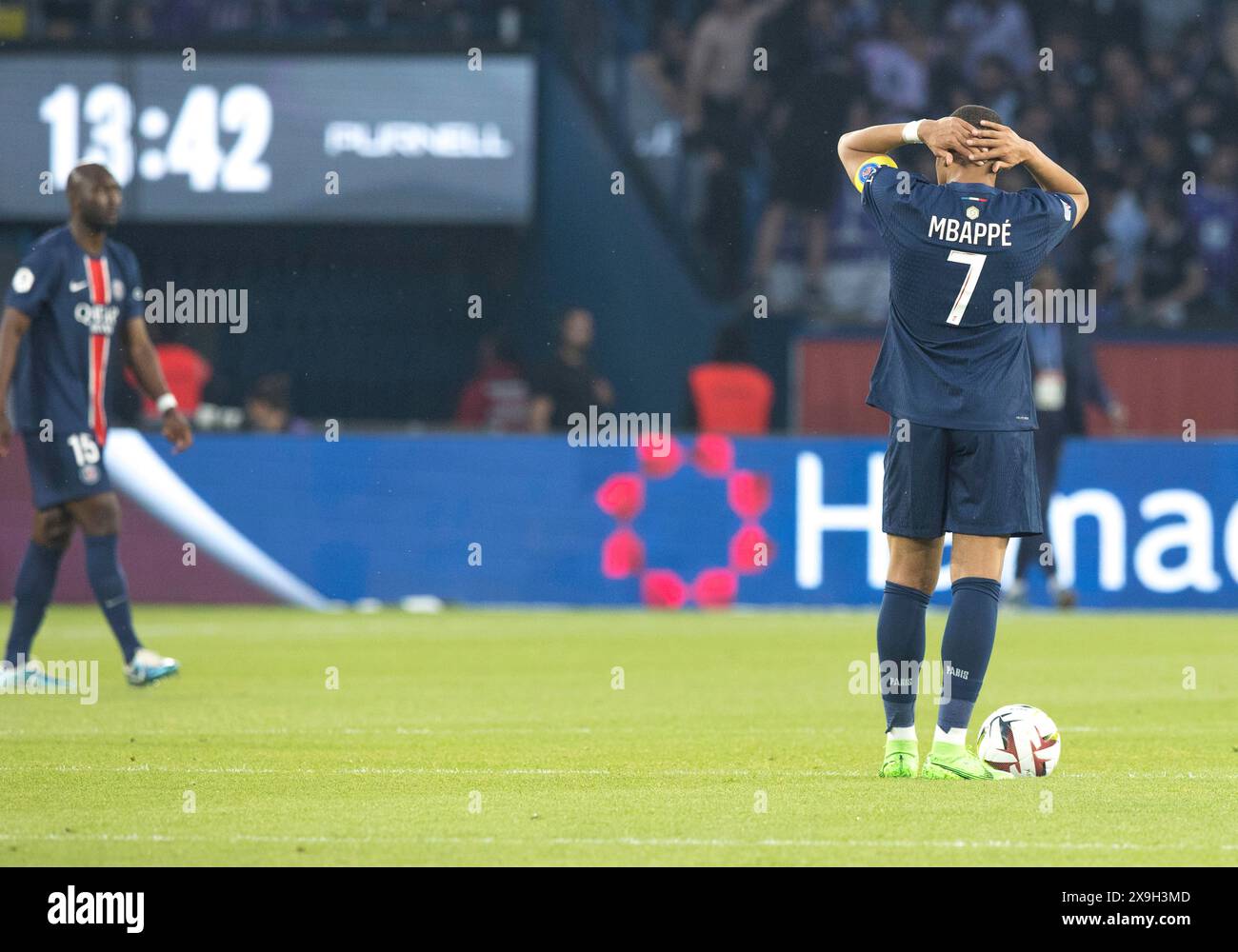 Football match, captain Kylian MBAPPE' looking from behind and holding ...