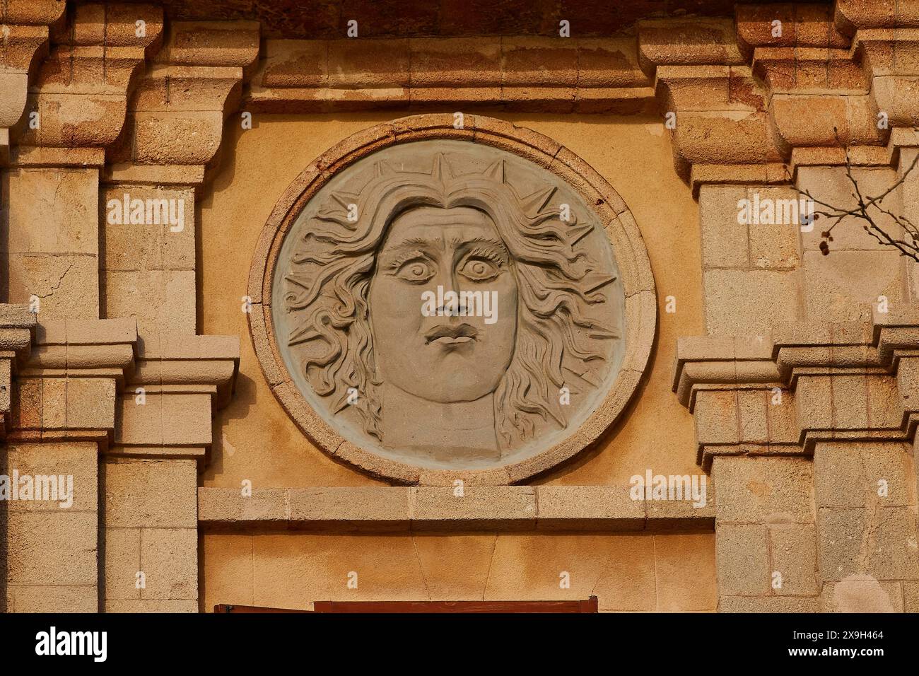 Sun god Helios, A relief of a sun face carved in stone on a historic ...