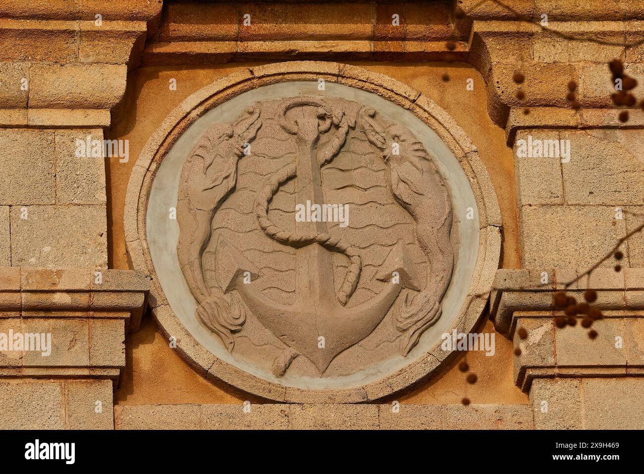 Architectural detail of a stone relief in the shape of an anchor, Old ...