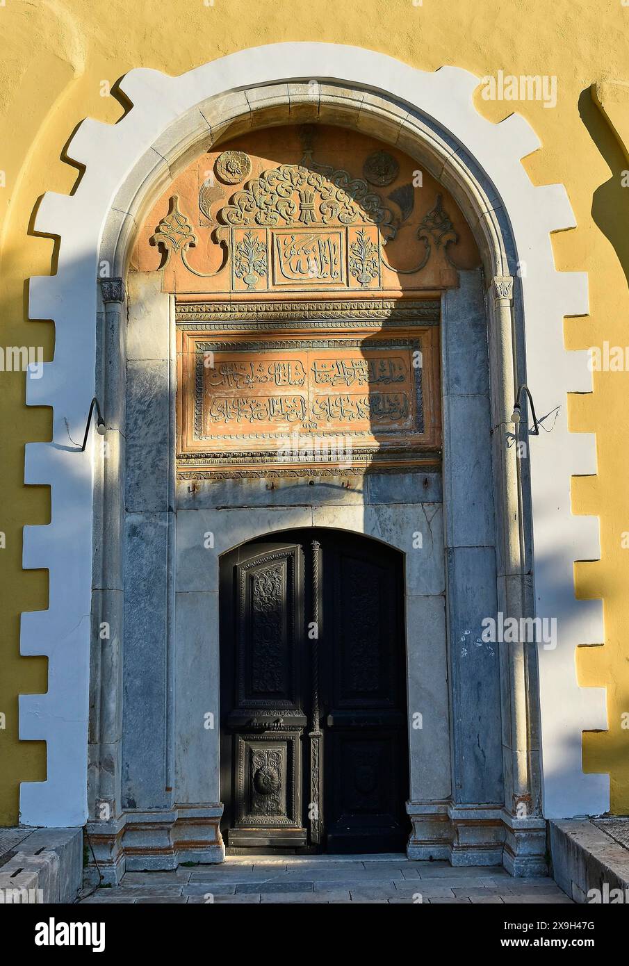 Ottoman Library, Historic entrance door with richly decorated archway ...