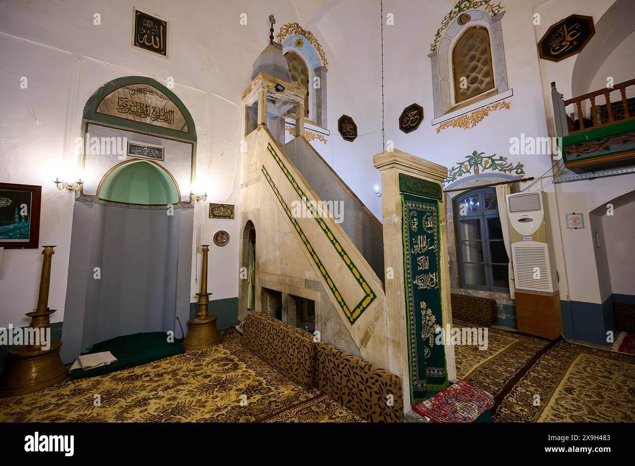 Retzep Pasha Mosque, Prayer room of a mosque with a decorative pulpit ...