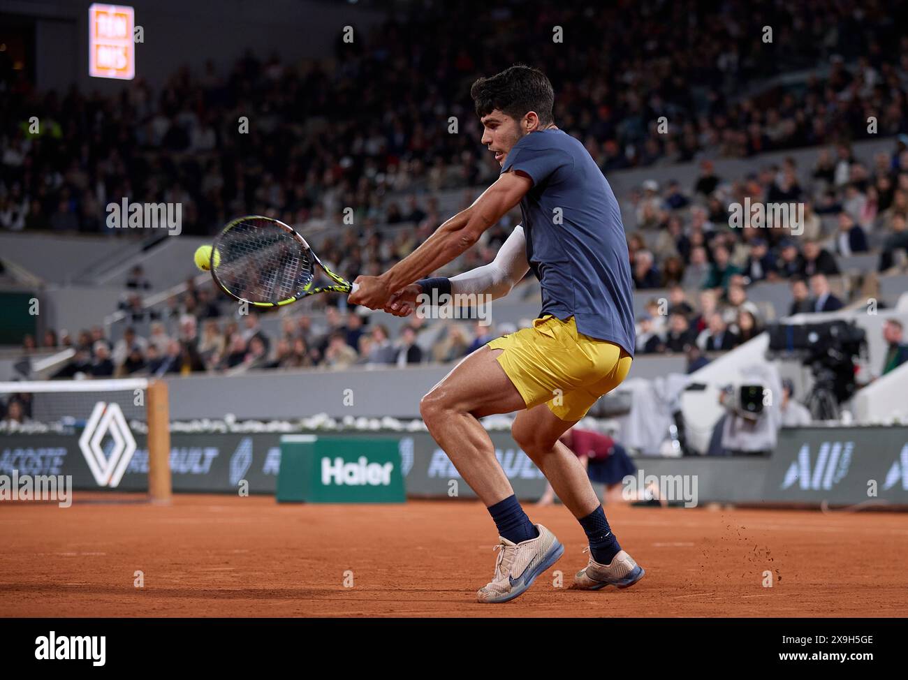 Carlos Alcaraz of Spain plays a backhand shot against Sebastian Korda ...