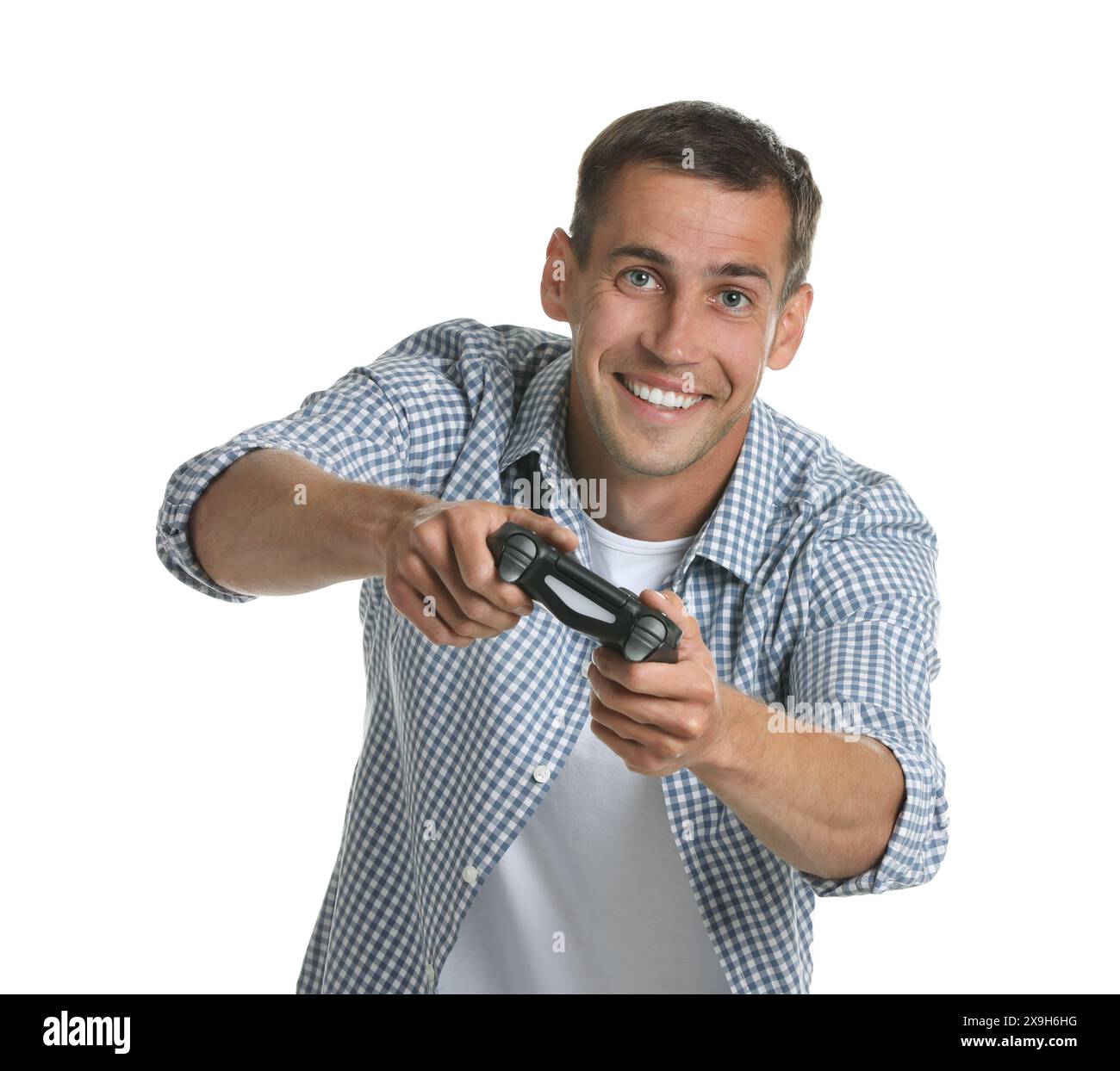 Happy man playing video games with controller on white background Stock ...