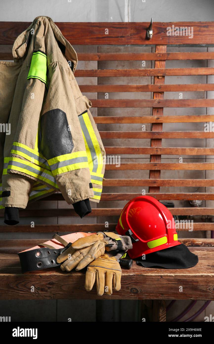 Firefighter`s uniform, helmet, gloves and mask at station Stock Photo ...