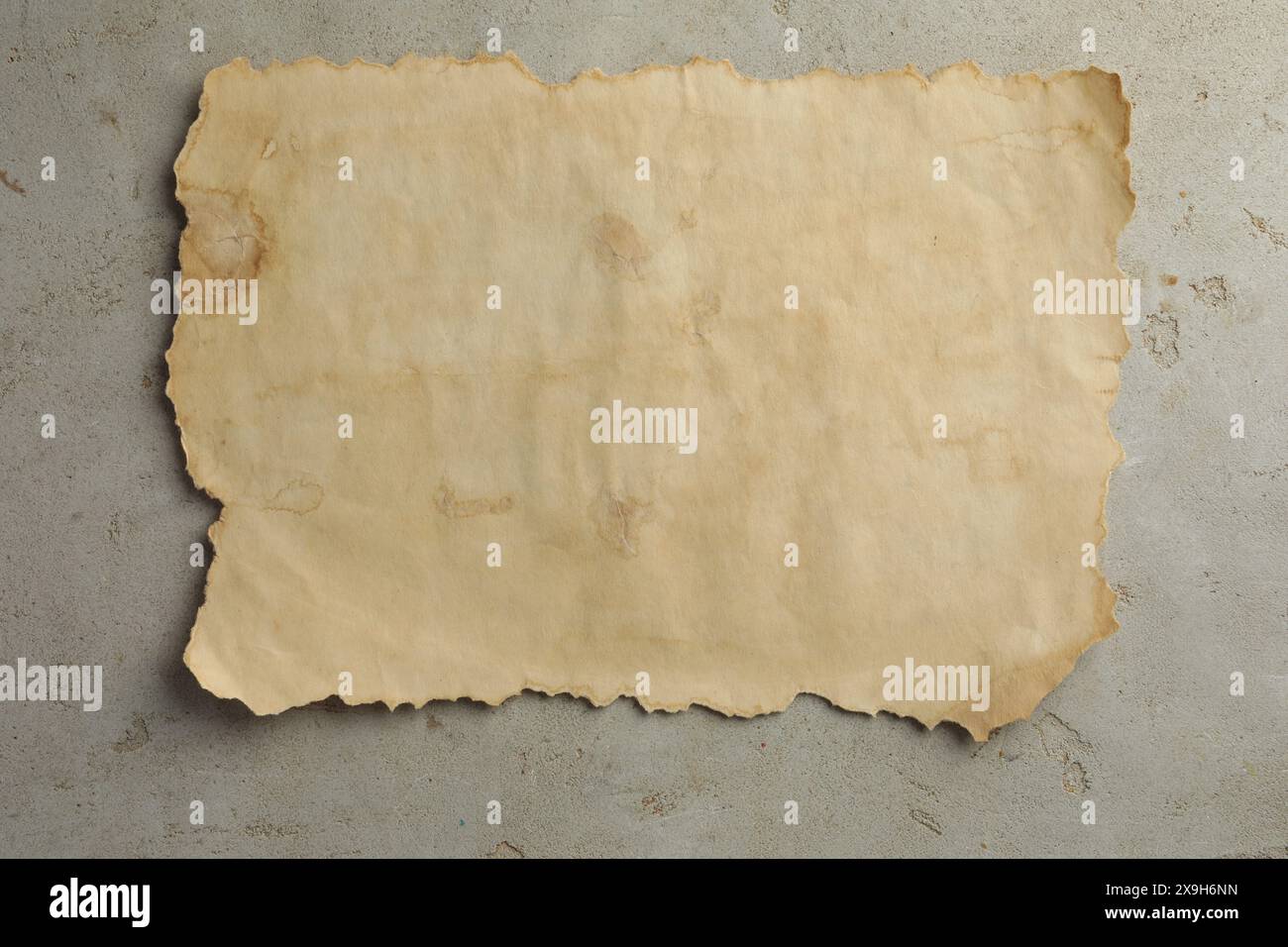 Sheet of old parchment paper on grey table, top view Stock Photo - Alamy