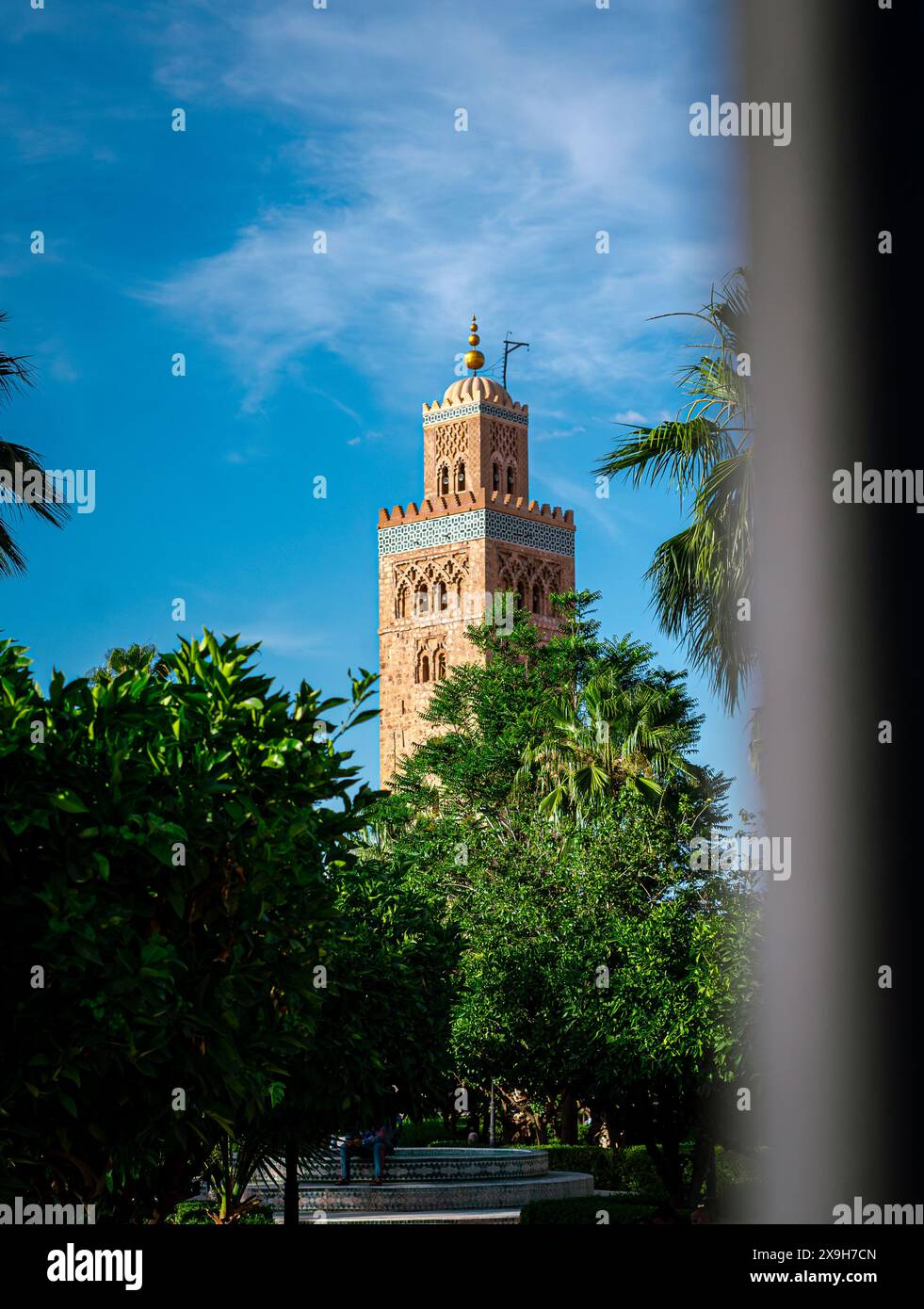 The Koutoubia Mosque tower, a tall minaret with a blue sky in the ...