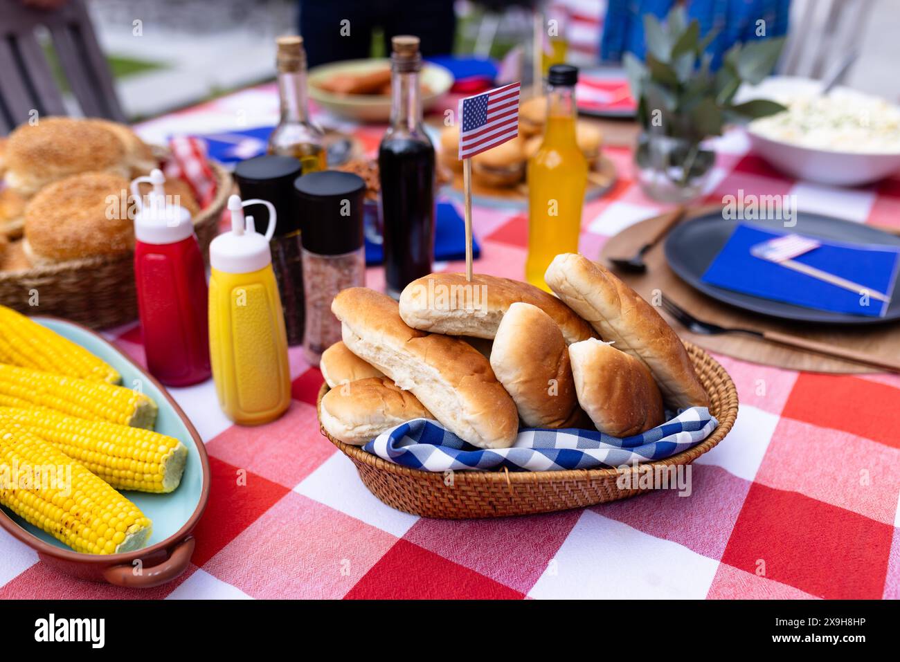 Close up of traditional american dinner with rolls, corns and flags of ...