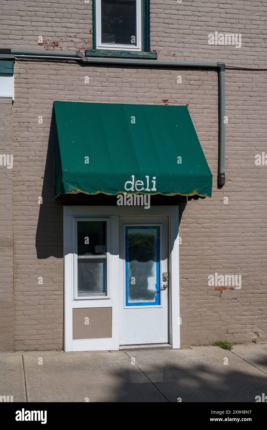 Petoskey, MI - May 18th, 2024:Small Deli Storefront with Green Canopy ...