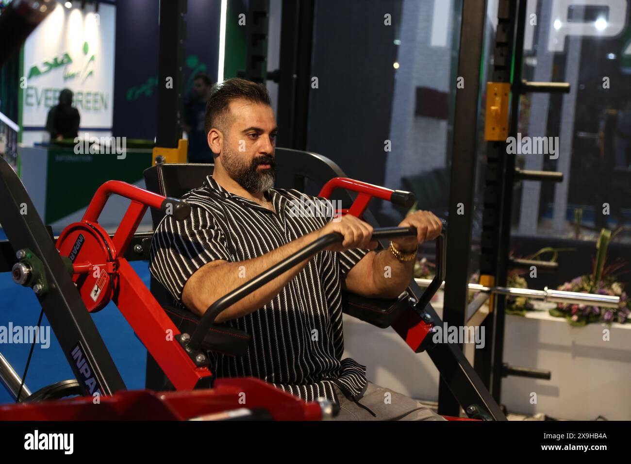 Tehran, Iran. 30th May, 2024. A man tries fitting equipment during the ...
