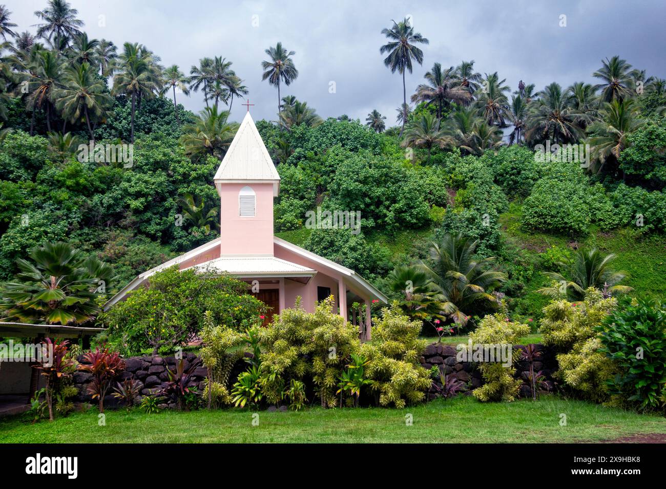 A small pink church at Puama'u, Iipona, on Hiva Oa, Marquesas Islands ...