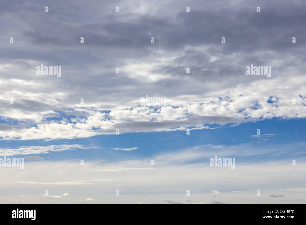 Beautiful view of scattered clouds in the sky. Dark cloud against a blue sky background. Clouds ...