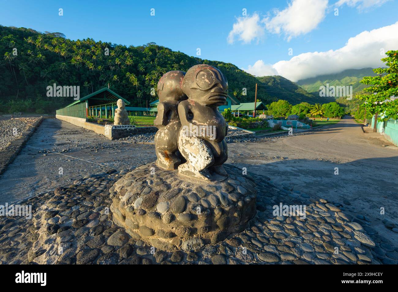 Two tiki statues in the small scenic village of Omoa, Fatu Iva ...
