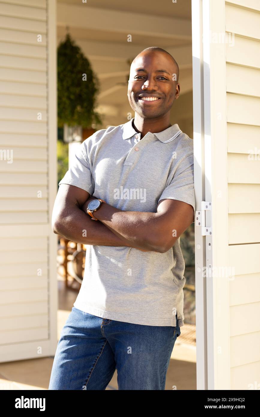 Confident young man stands arms hi-res stock photography and images - Alamy