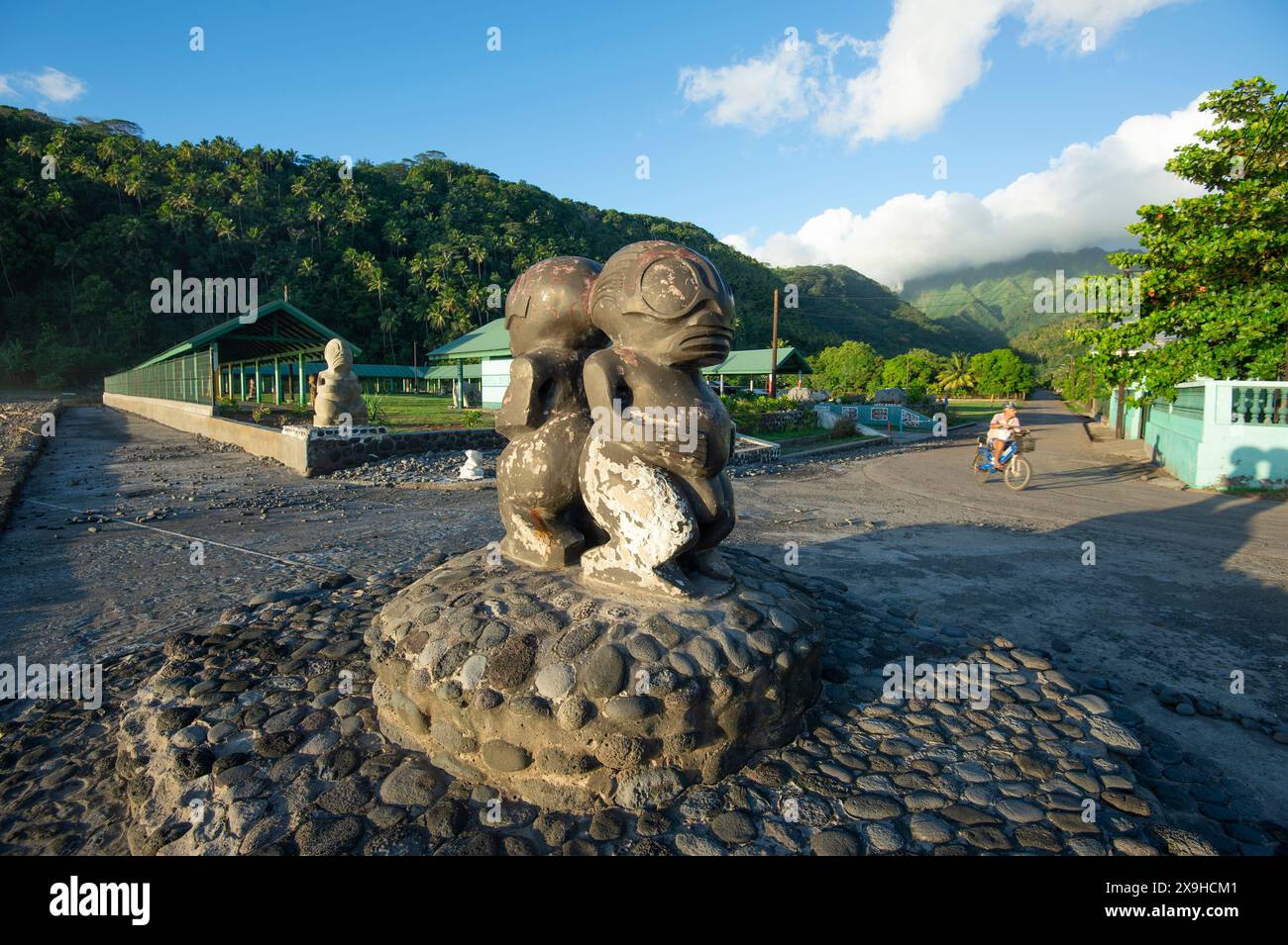 Two tiki statues in the small scenic village of Omoa, Fatu Iva ...