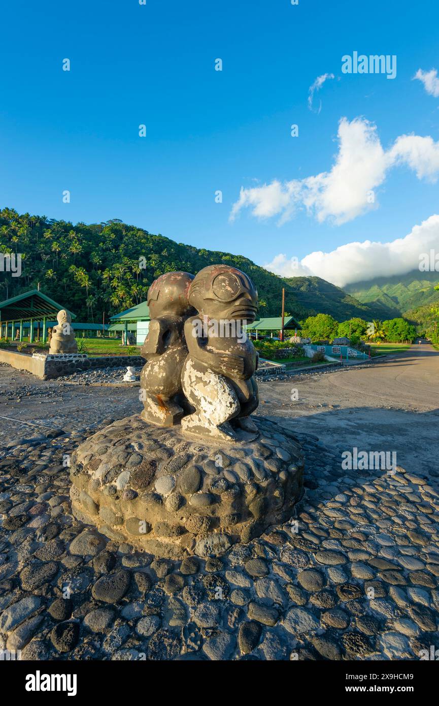 Two tiki statues in the small scenic village of Omoa, Fatu Iva ...