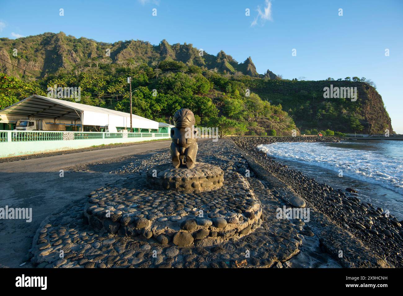 Tiki statue in the small scenic village of Omoa, Fatu Iva, Marquesas ...