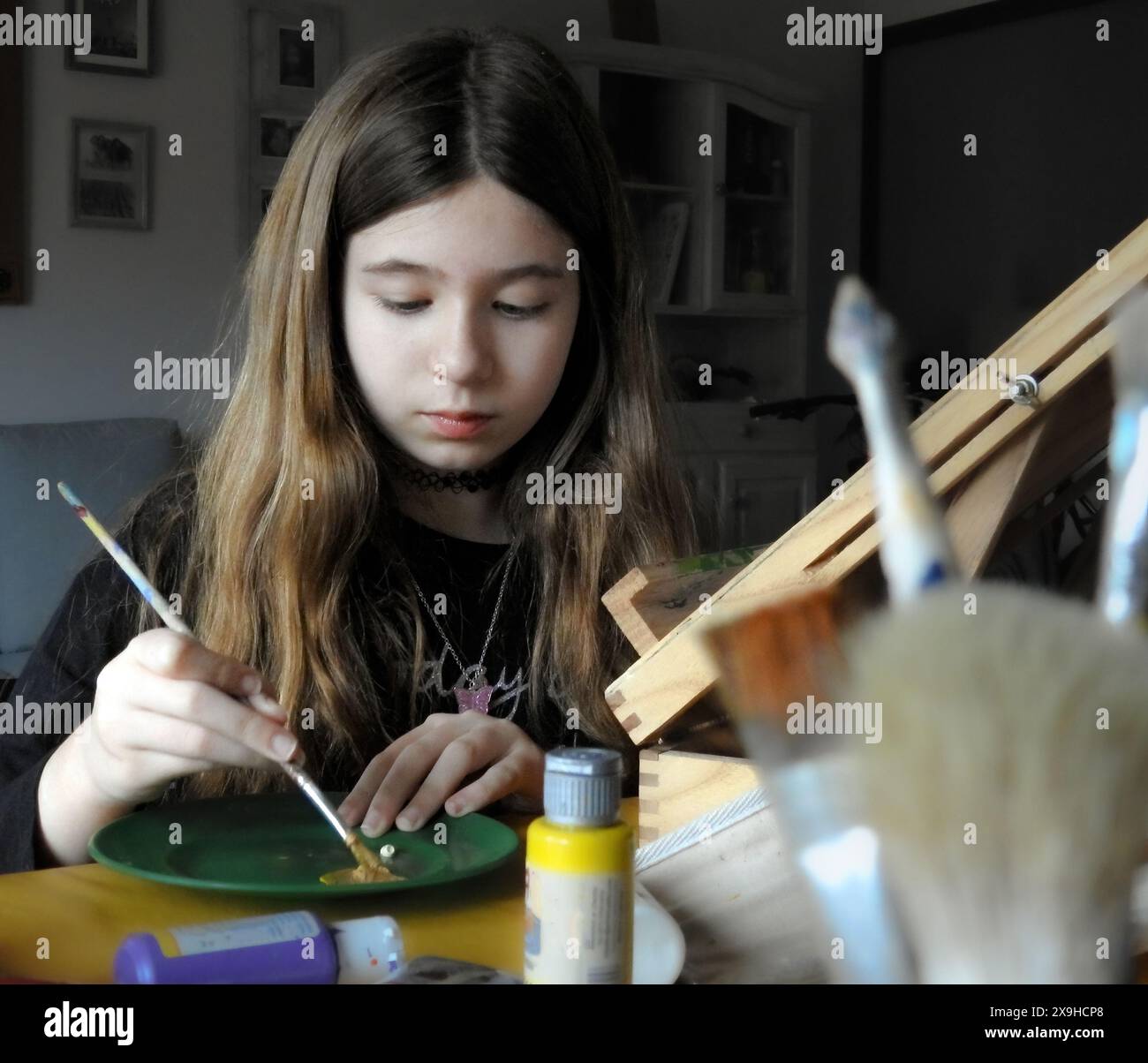 Cute girl painting at home. Selective focus. School homework Stock ...