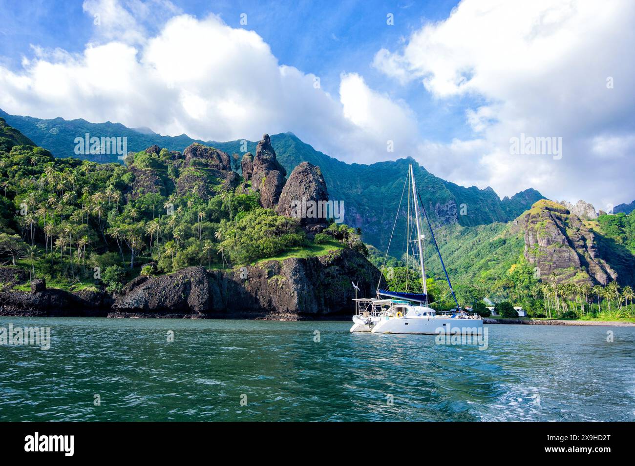 Sailing boat anchored at the renowned bay of Hanavave in Fatu Iva ...