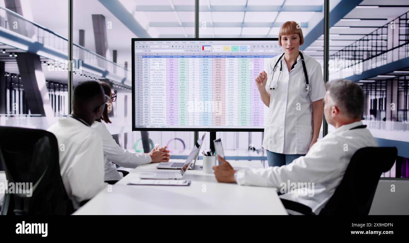 Doctor Showing Medical Codes Training Presentation In Hospital Stock ...