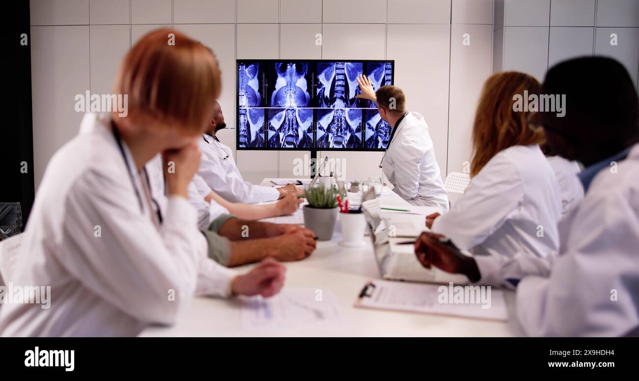 Diverse Doctors Team Looking At MRT Scans Stock Photo - Alamy