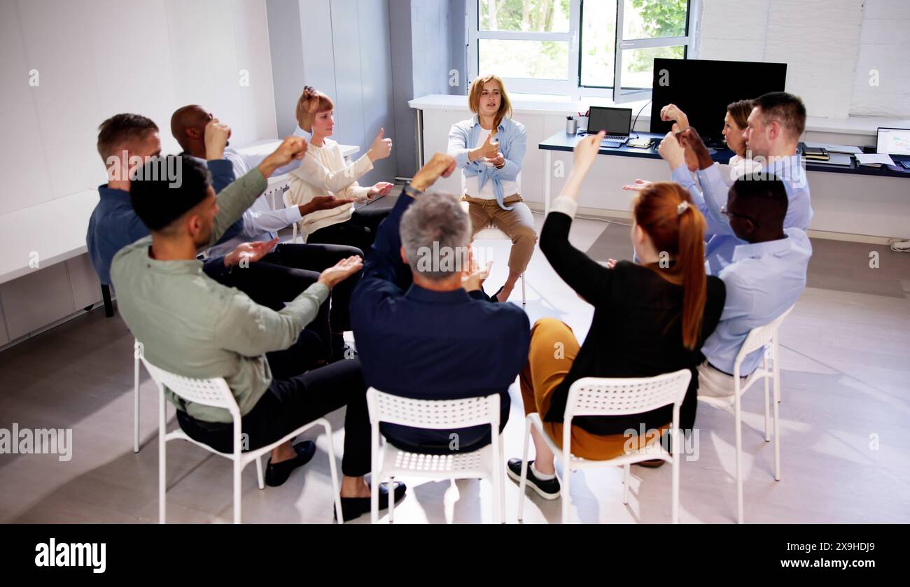 Group Of Young People Learning Deaf Gesture Sign From Woman Stock Photo ...