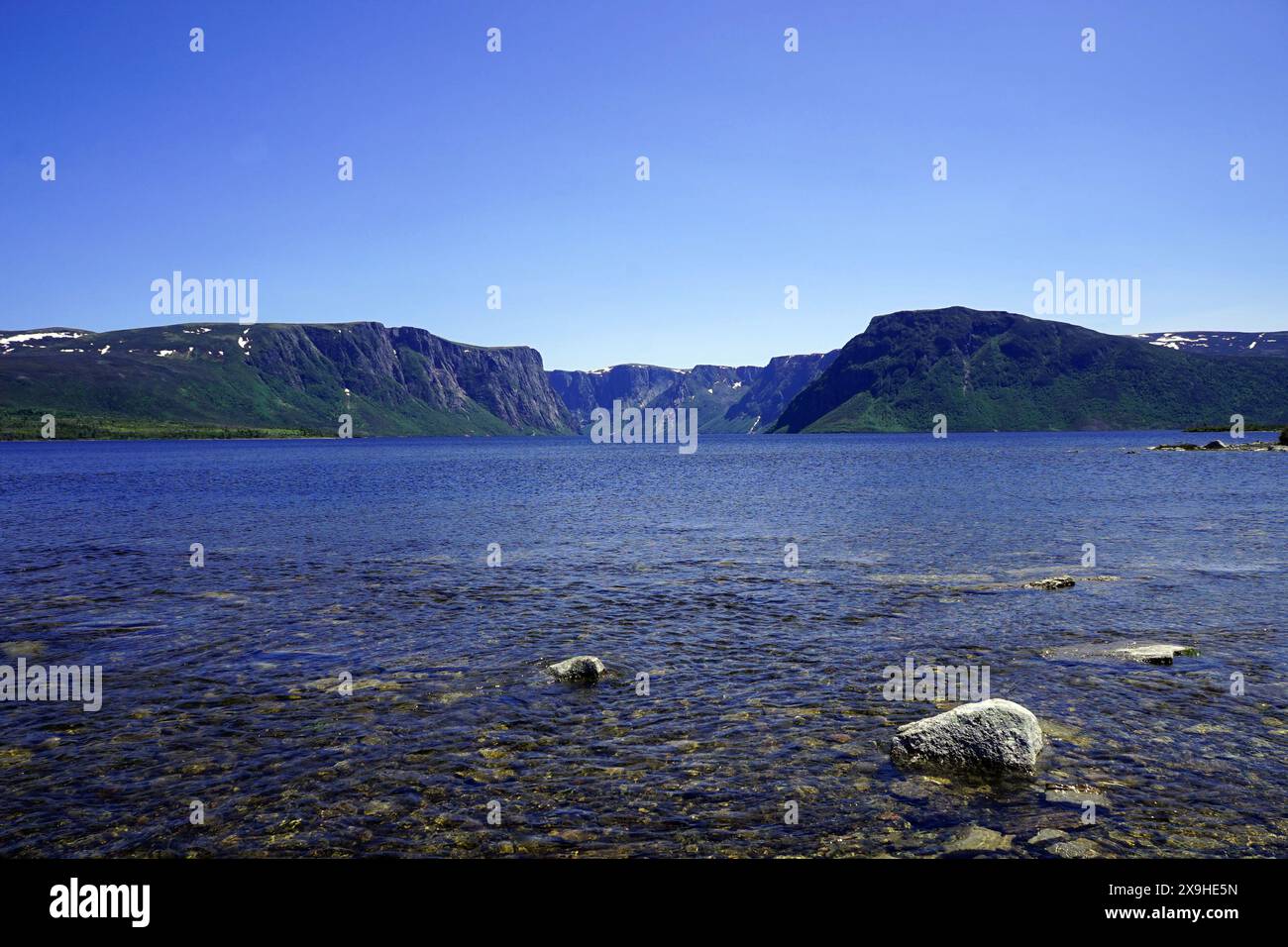 Snow-capped peaks above Western Brook Pond in Newfoundland's Gros Morne ...