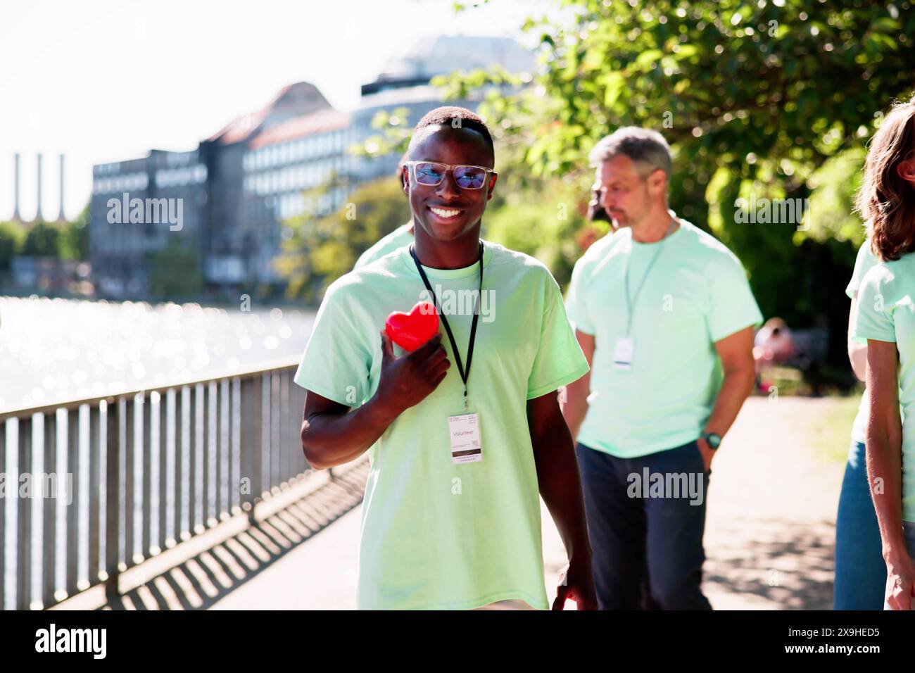 Volunteer Holding Heart Symbol Shape, Social Care Stock Photo - Alamy