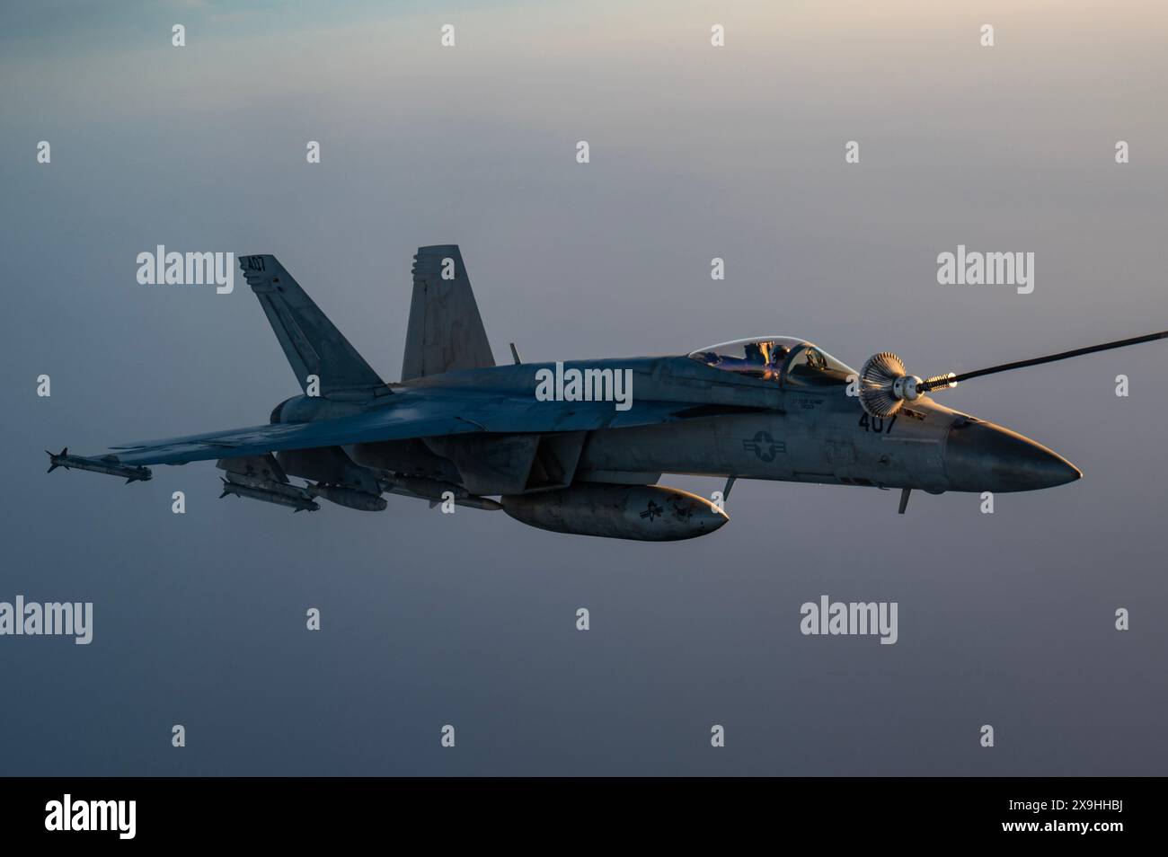 A U.S. Navy F/A-18E Super Hornet receives fuel from a U.S. Air Force KC ...