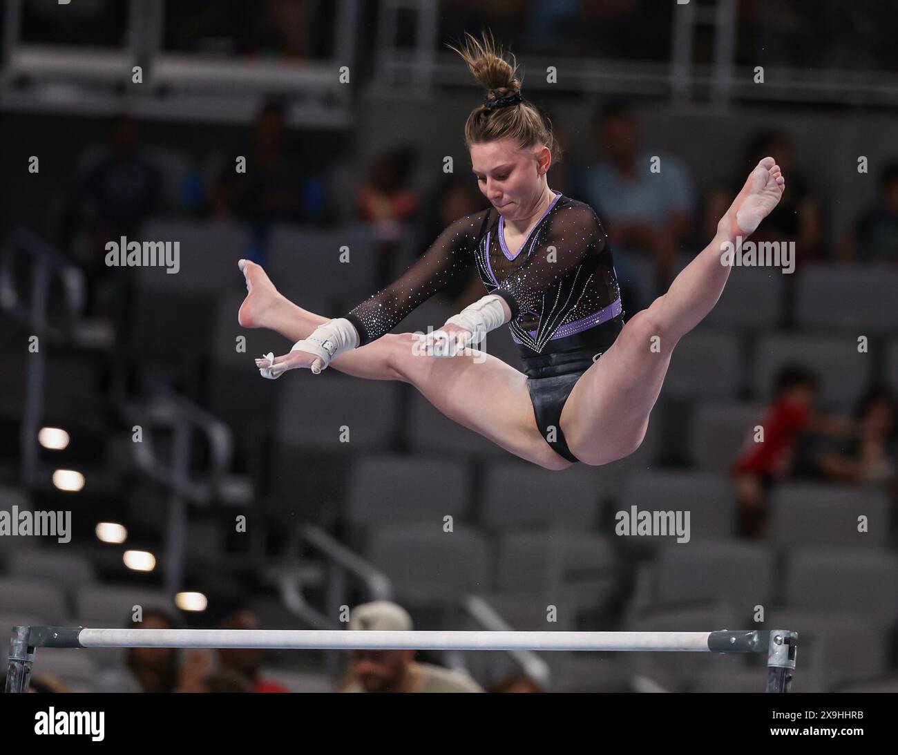 May 31, 2024: Ashlee Sullivan competes on the uneven parallel bars ...