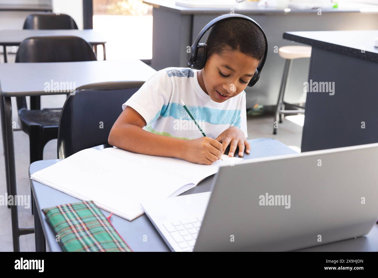 Biracial boy learning online using hi-res stock photography and images - Alamy
