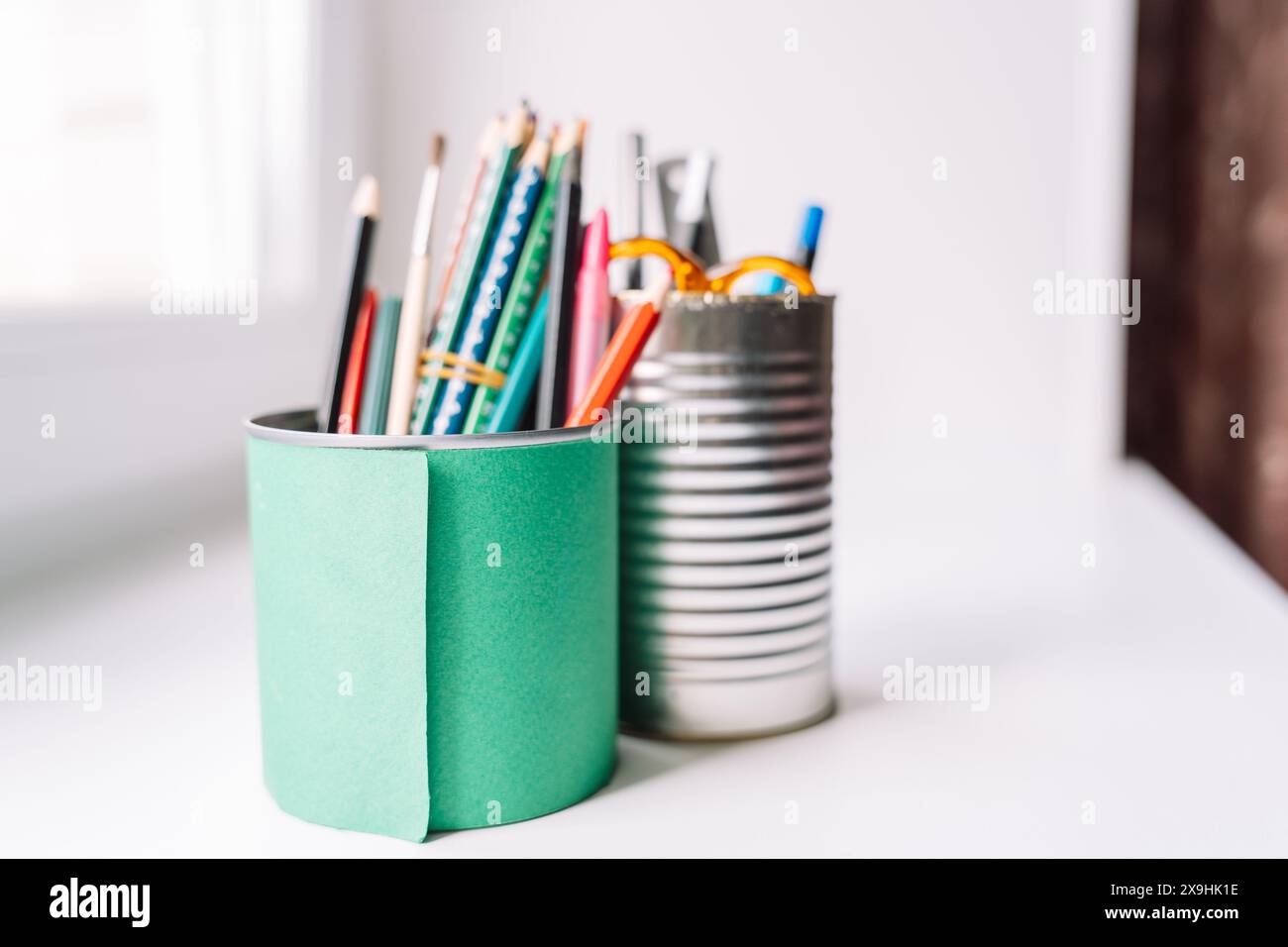 Recycling tin cans for office supplies Stock Photo - Alamy