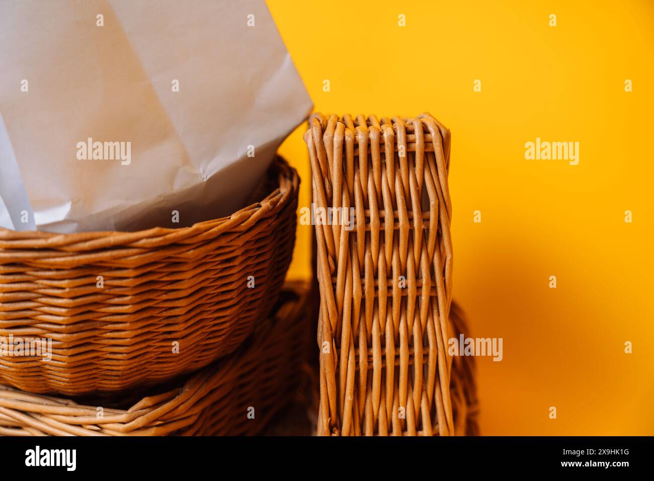 Recycling waste paper for weaving baskets on a yellow background Stock ...