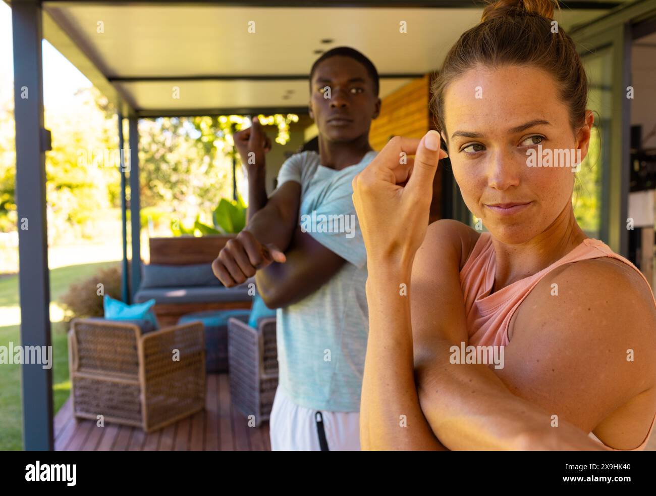 A diverse young couple, standing outside, showing off ring Stock Photo ...