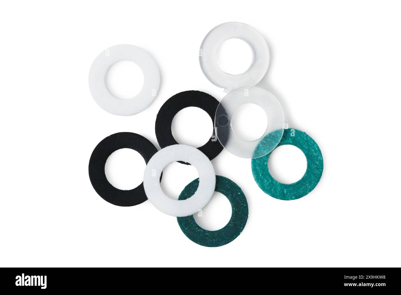 Set of pipe gaskets from various materials isolated on a white ...