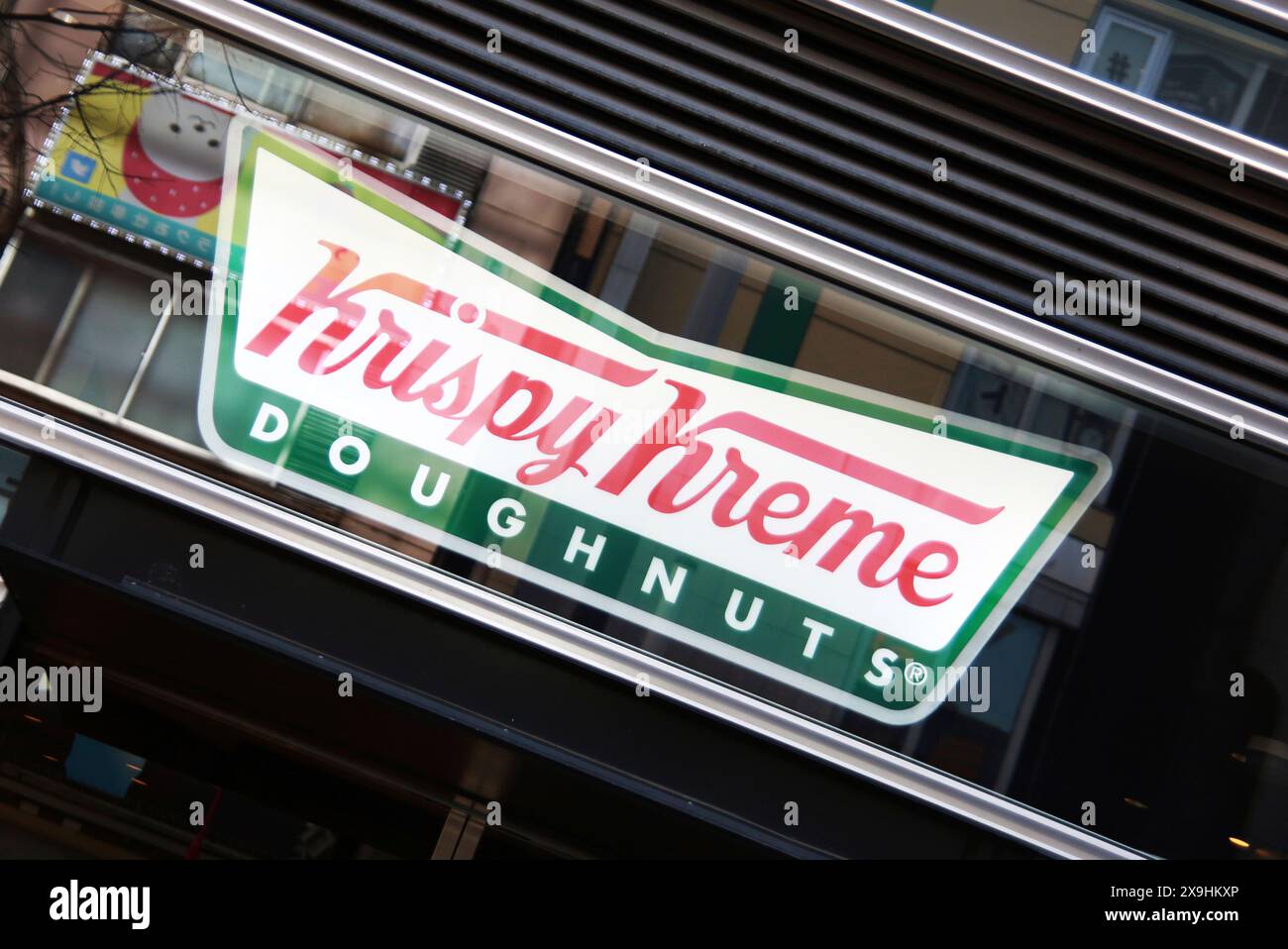 The trademark of Krispy Kreme Doughnuts is seen in Shinjuku Ward, Tokyo ...