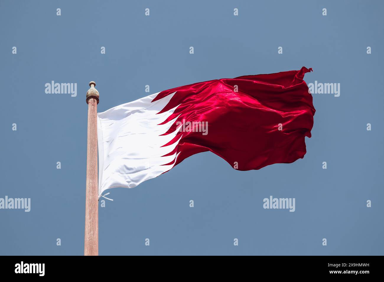 Waving flag of Qatar, in Doha Stock Photo - Alamy