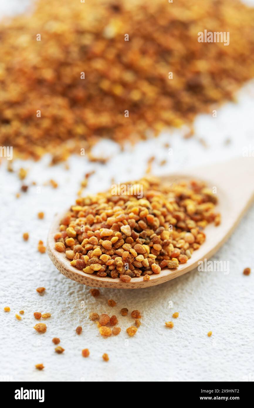 Healthy bee pollen grains. Bee pollen on a wooden spoon Stock Photo - Alamy