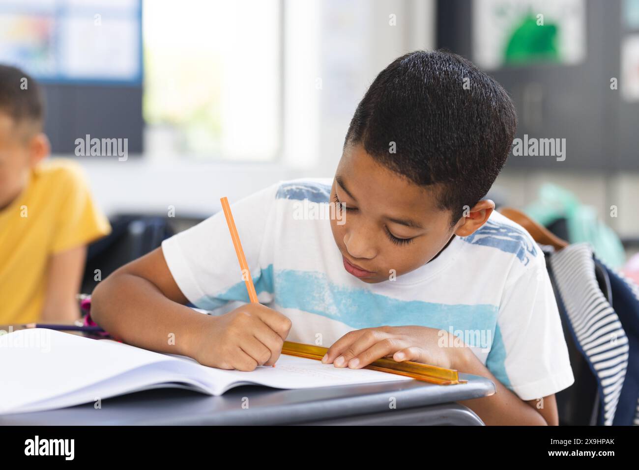 Child writing with pencil hi-res stock photography and images - Alamy