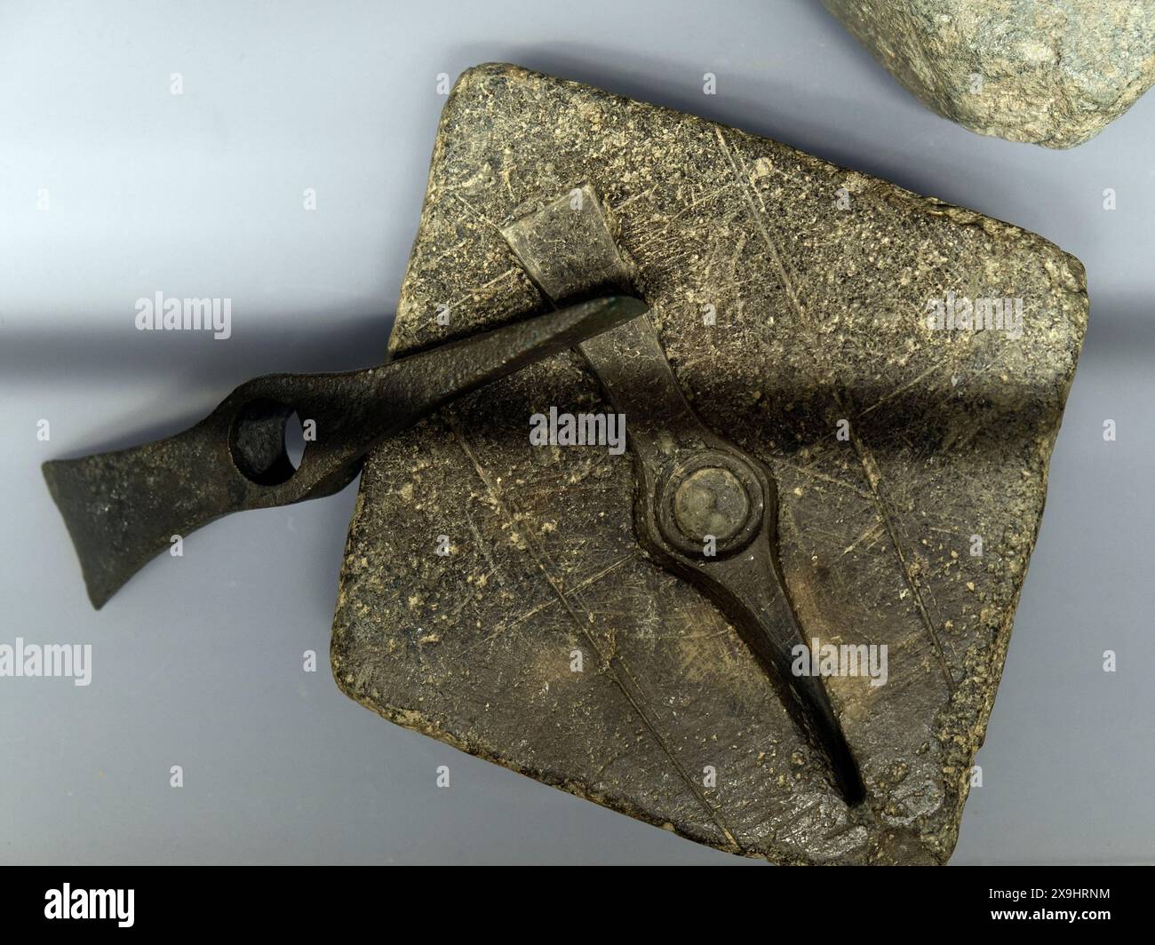 an Iron Age stone mold for casting axes Stock Photo - Alamy