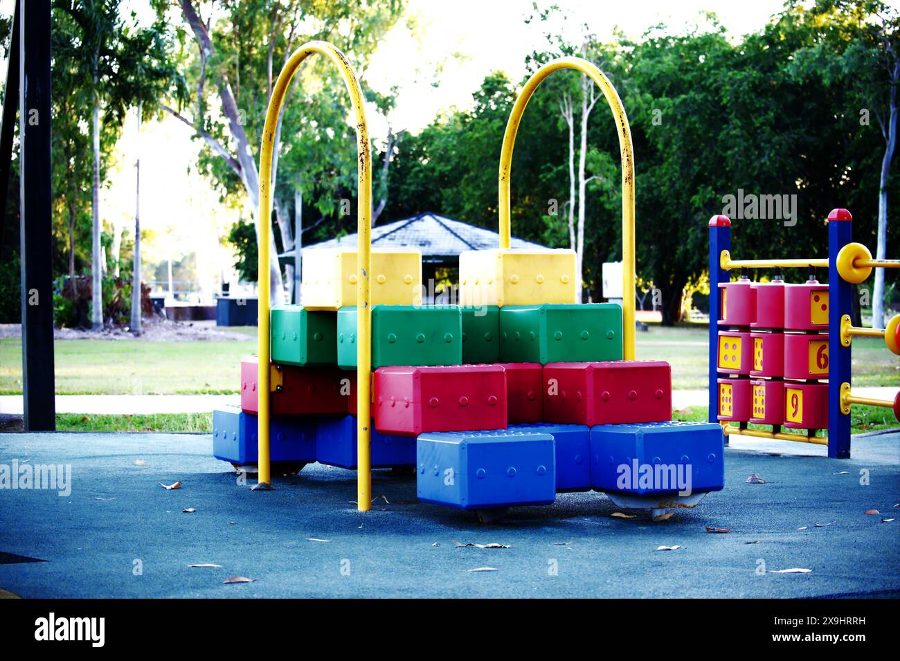red, yellow, blue and green children's playground equipment in a public ...