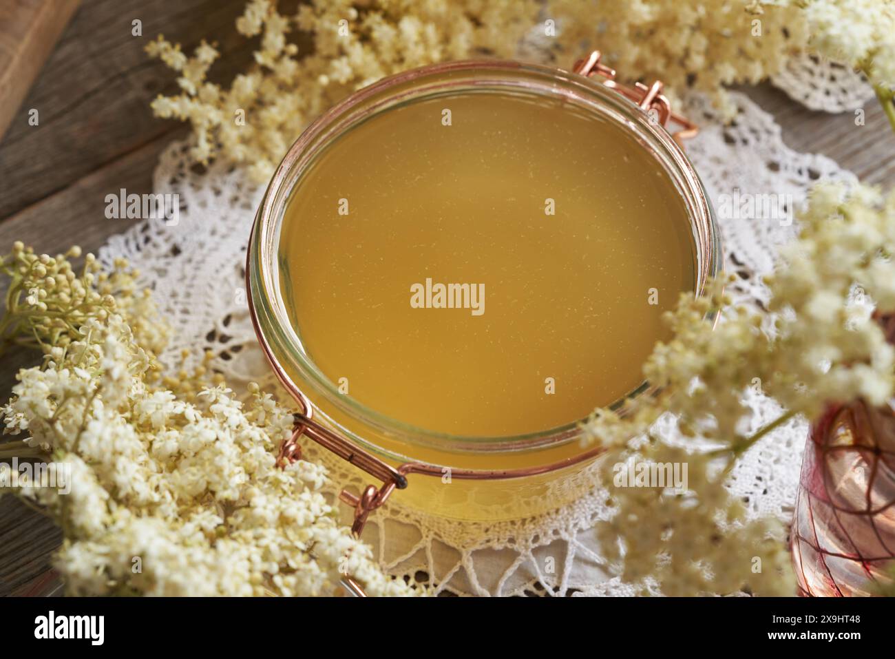 Homemade elderberry flower syrup in a glass jar Stock Photo - Alamy