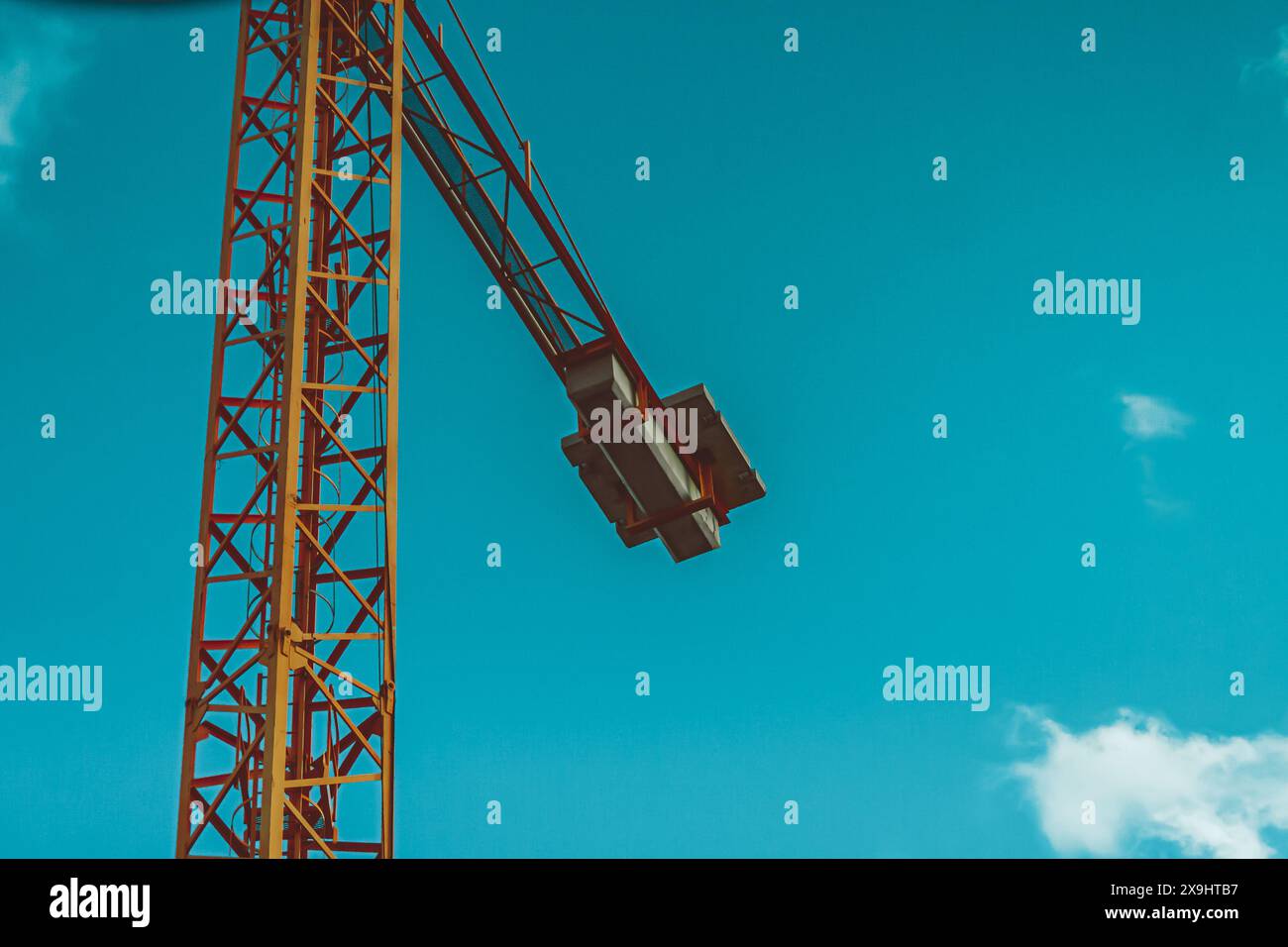 From below of contemporary metal construction crane with cables and ...