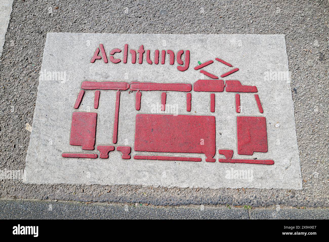 Tram Warning Sign Embedded into the Walkway in Cologne, Germany Stock ...