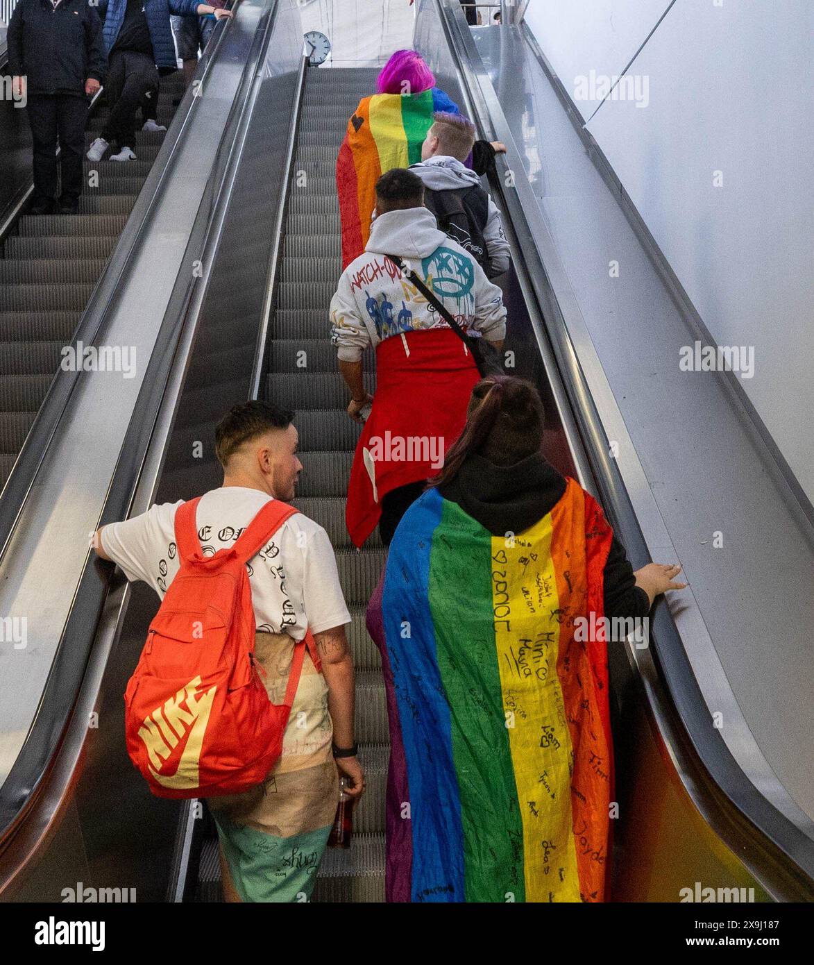 01 June 2024, Saxony, Dresden: People on an escalator in the station ...