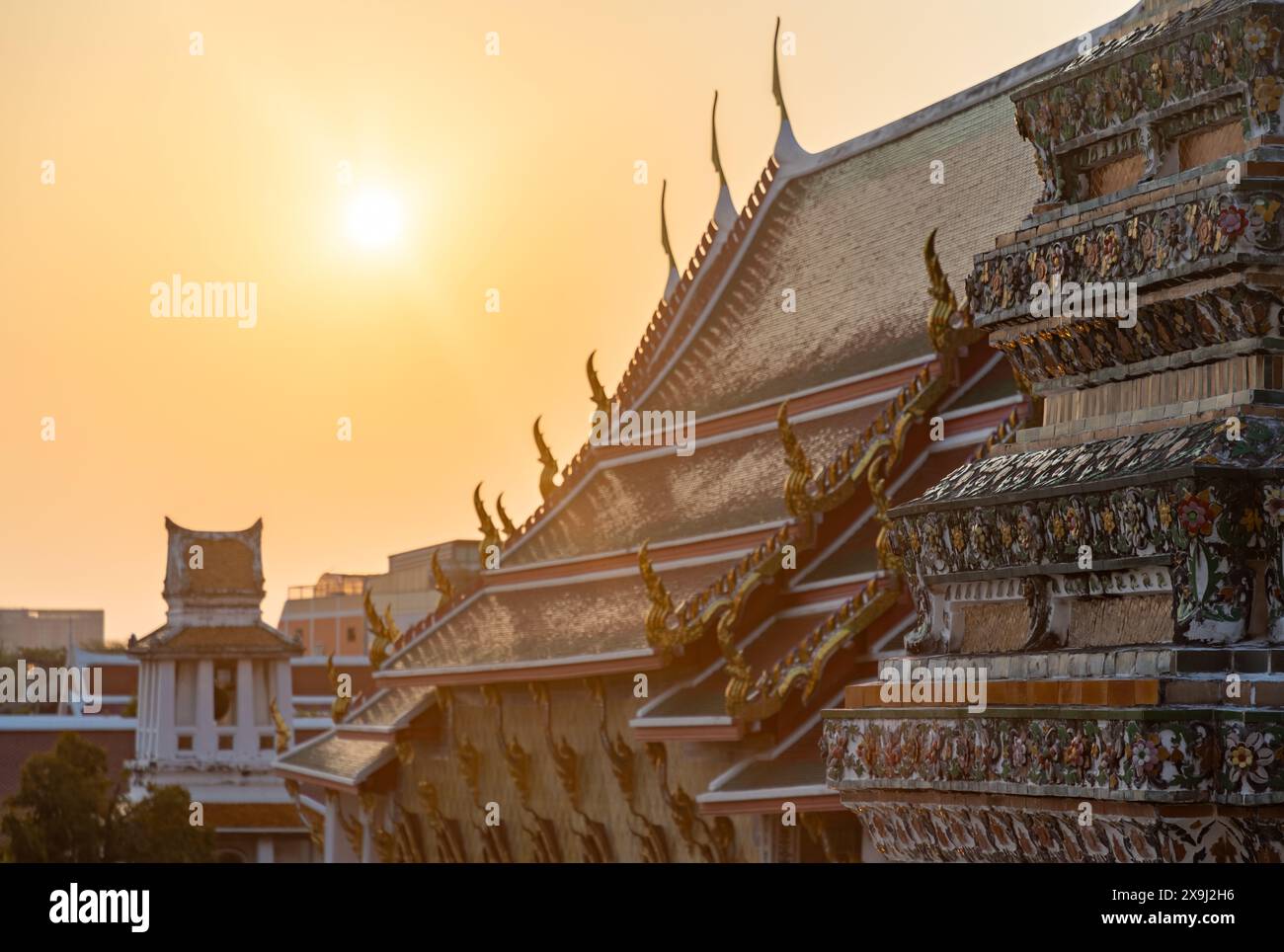 A picture of the Vihara hall behind one of the satellite prangs at the ...